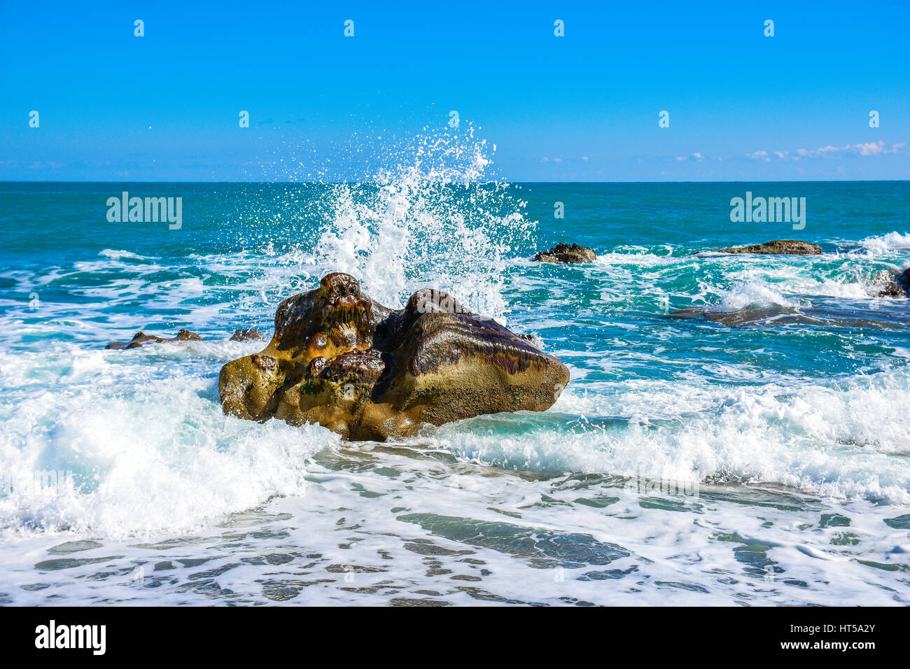 Large wave crash against the rocks at the beach Stock Photo - Alamy