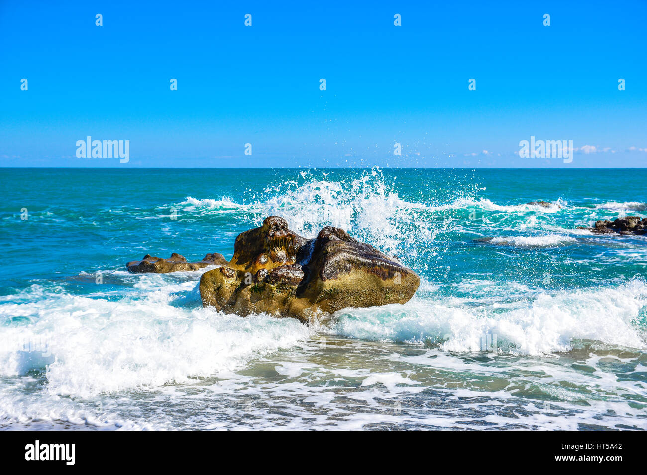 Large wave crash against the rocks at the beach Stock Photo - Alamy