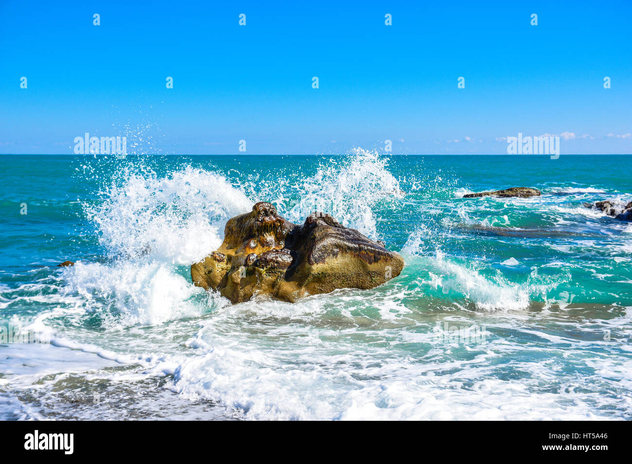 Large wave crash against the rocks at the beach Stock Photo - Alamy