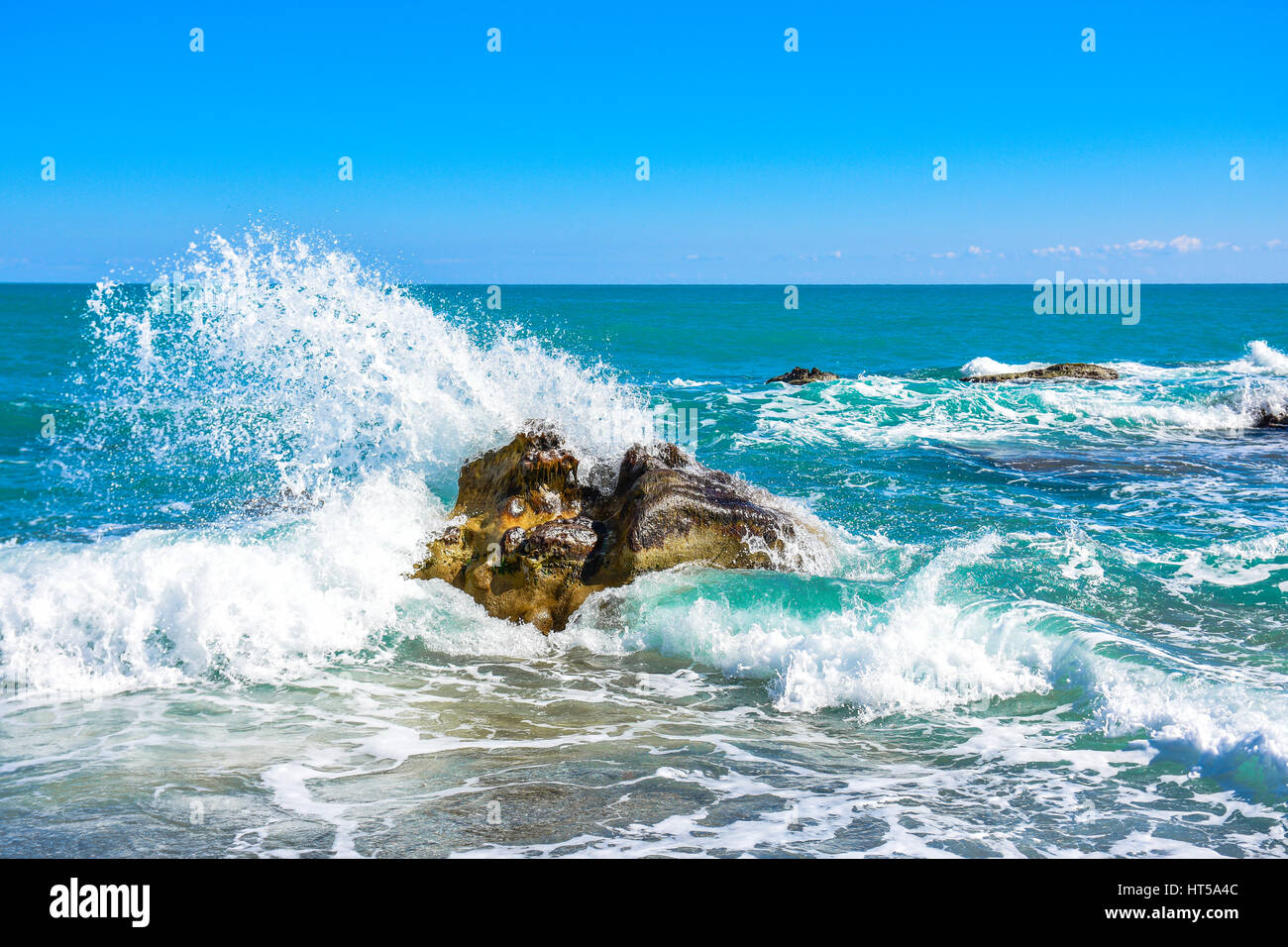 Large wave crash against the rocks at the beach Stock Photo - Alamy
