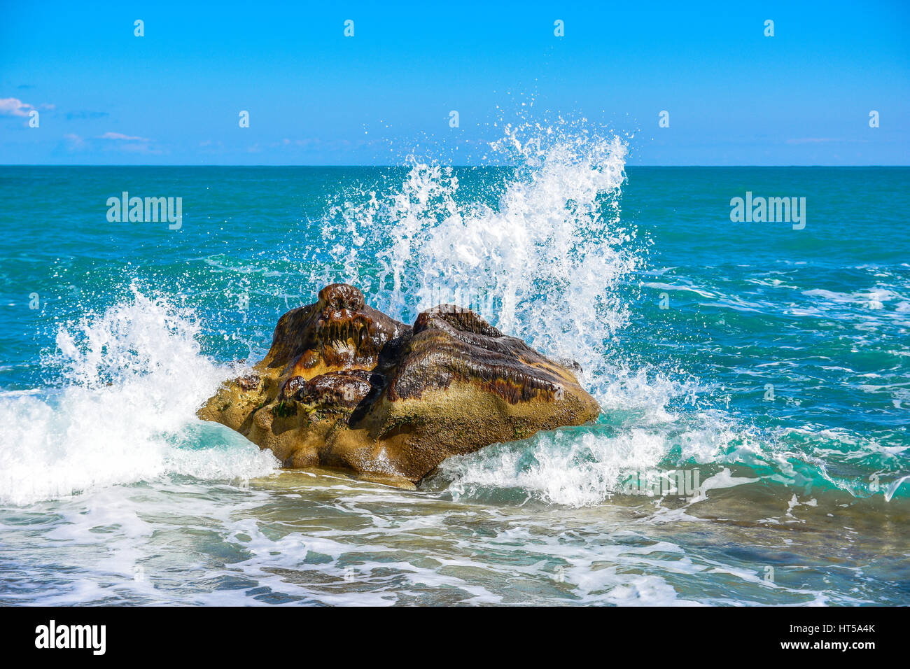 Large wave crash against the rocks at the beach Stock Photo - Alamy