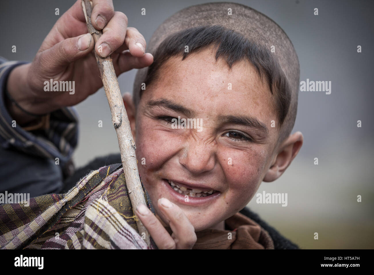 Afghanistan, Wakhan corridor, a portrait of a smiling happy boy ...