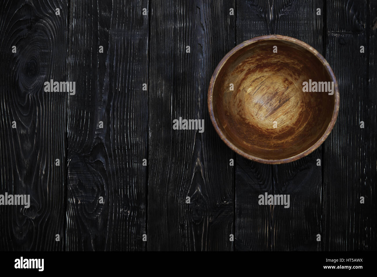 Empty wooden bowl on a vintage table Stock Photo - Alamy