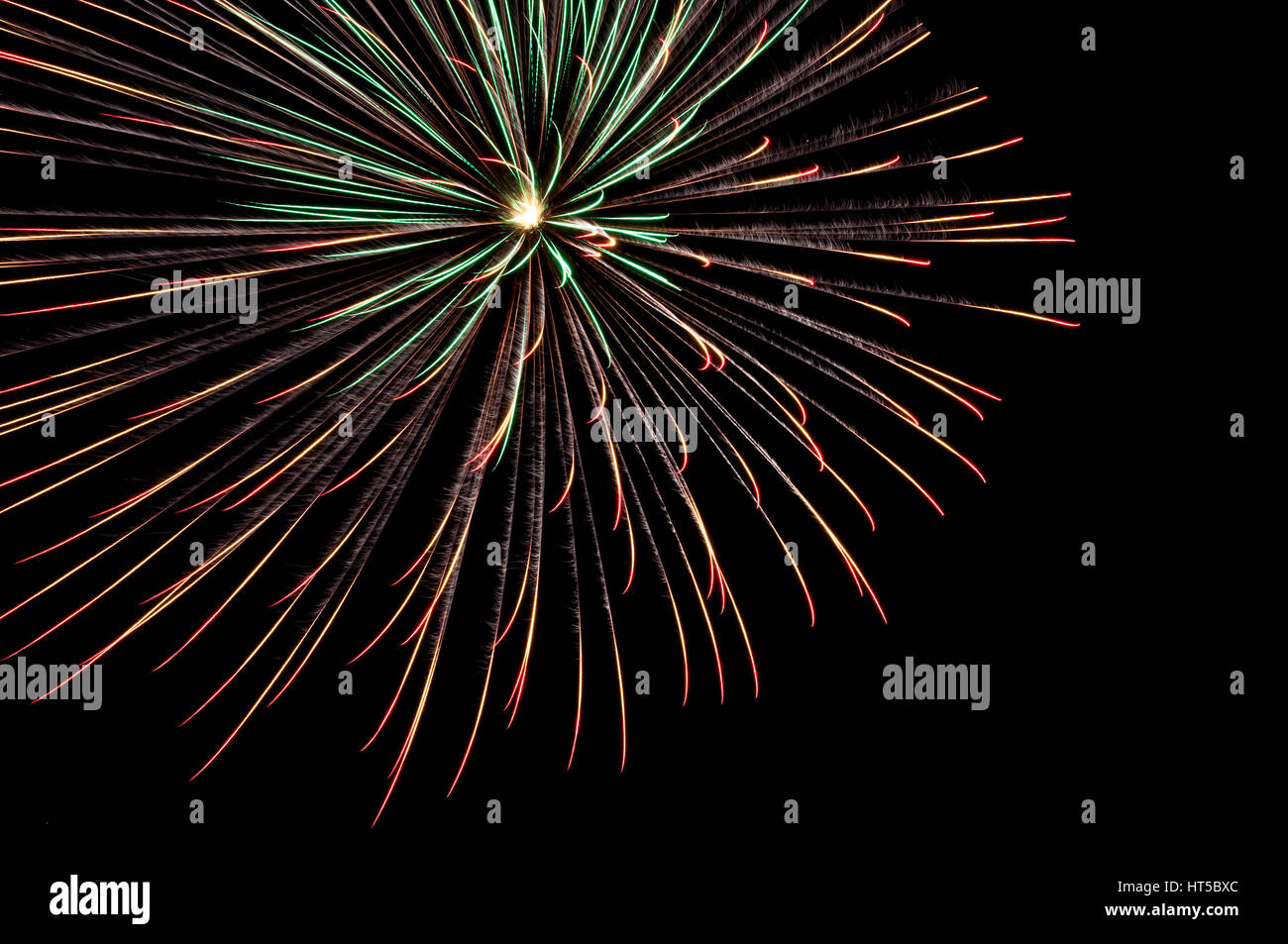 big green and red firework on black background Stock Photo - Alamy