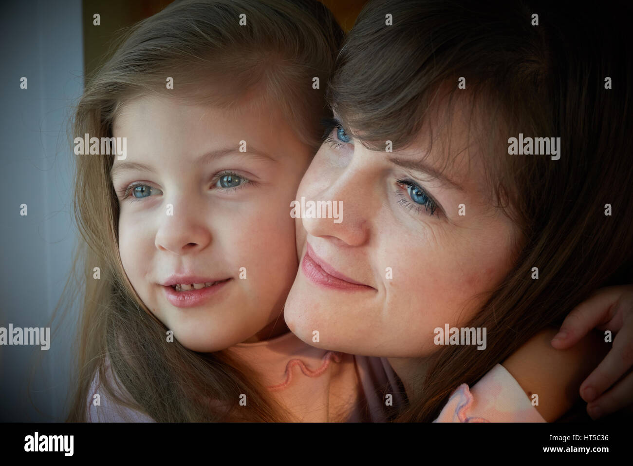 Mom and daughter hug. A symbol of love. Heart Stock Photo - Alamy