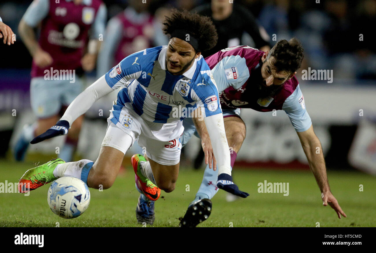 Huddersfield Town's Isaiah Brown(left) is fouled by Aston Villa's Mile ...