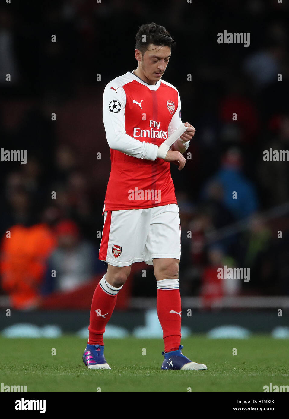 Arsenal's Mesut Ozil looks dejected after the UEFA Champions League ...