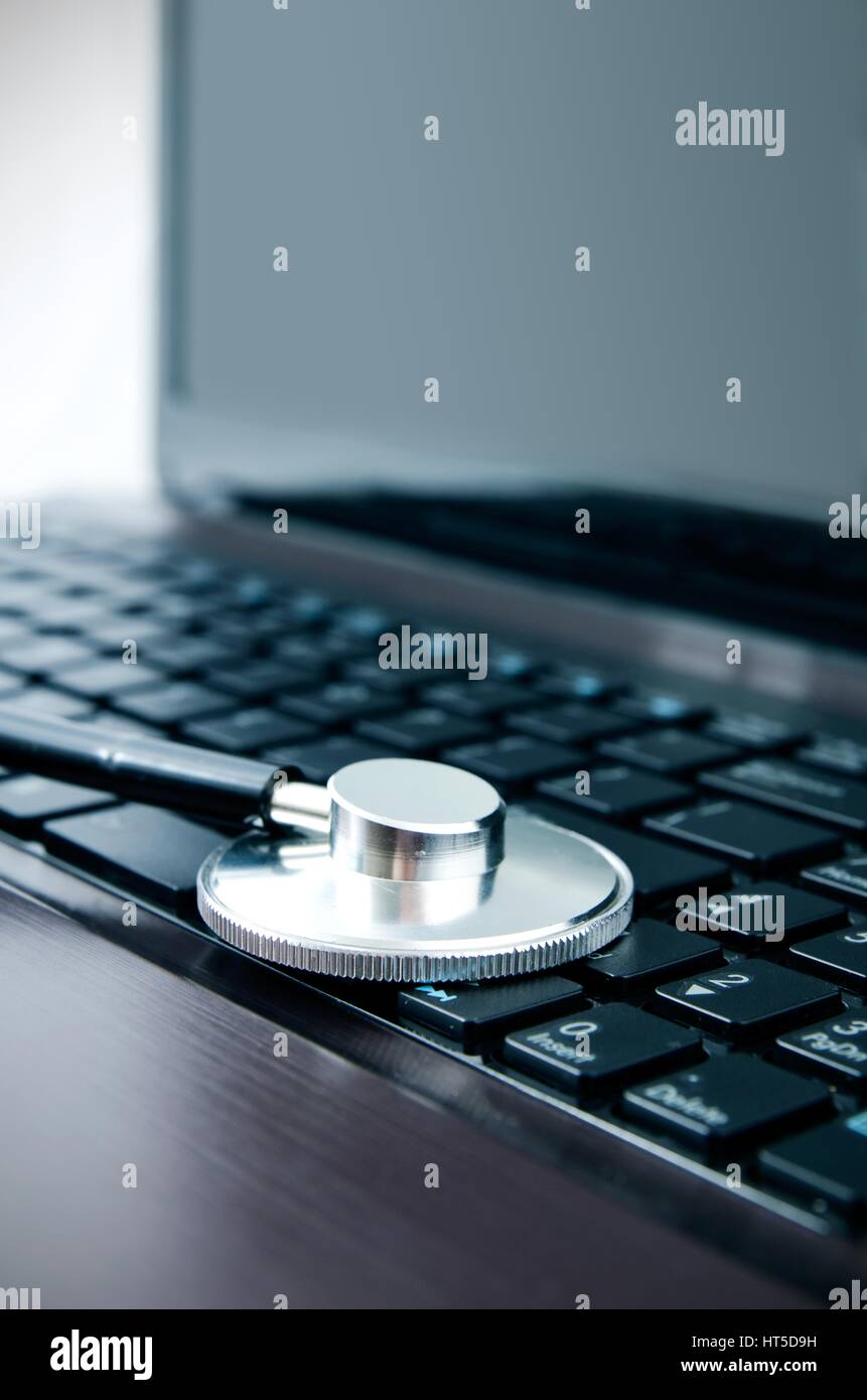 Diagnosis and repair of computers. Stethoscope on laptop Stock Photo ...