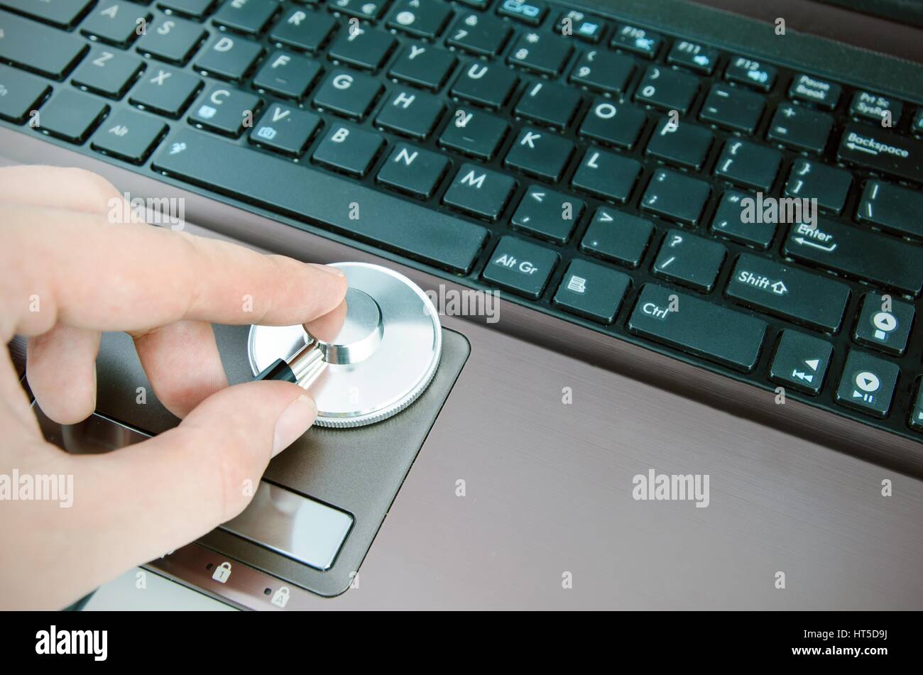 Diagnosis and repair of computers. Stethoscope on laptop Stock Photo ...