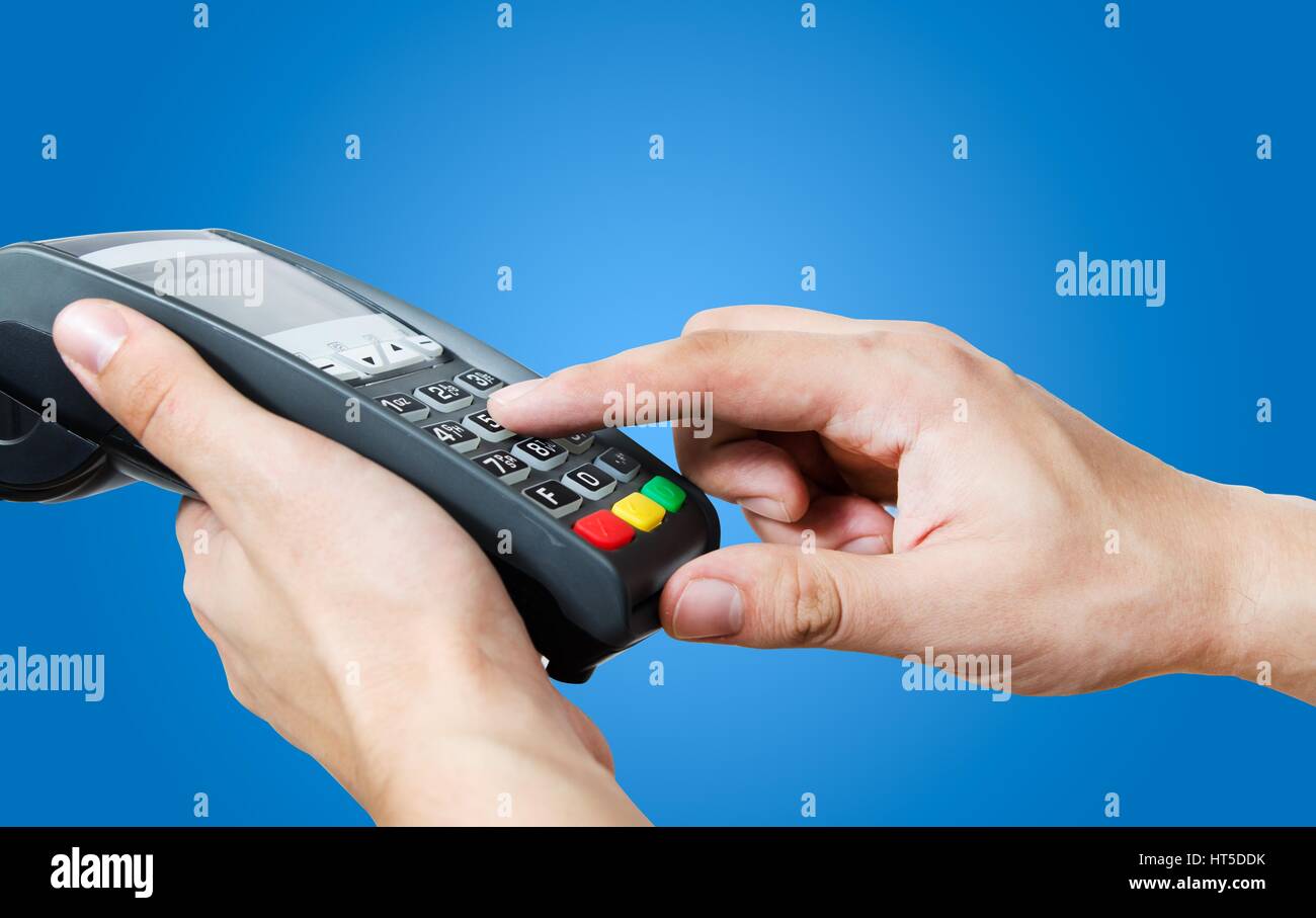 Hand with credit card swipe through terminal for sale Stock Photo - Alamy