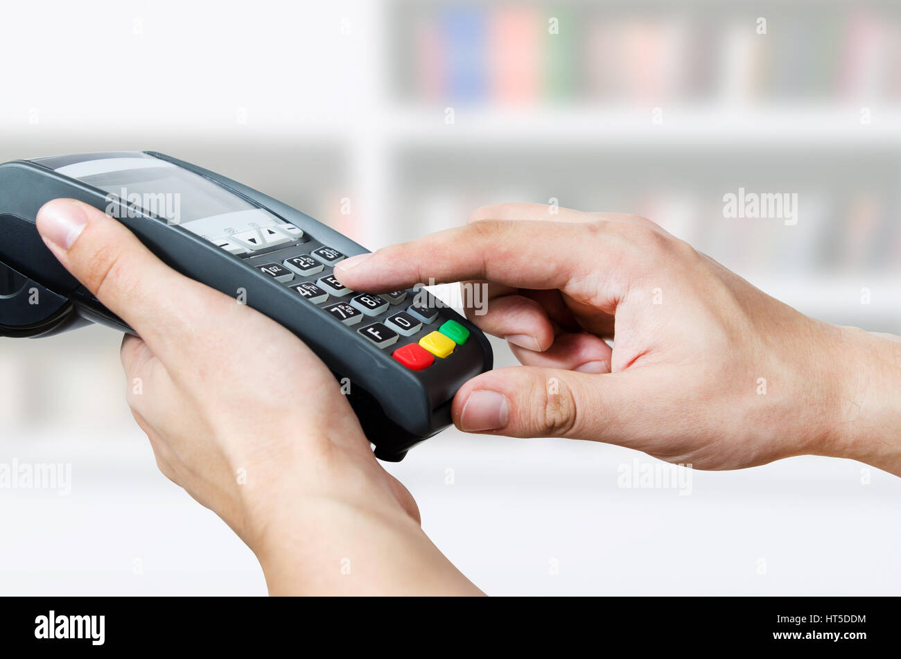Credit card swipe through terminal for sale in store Stock Photo - Alamy