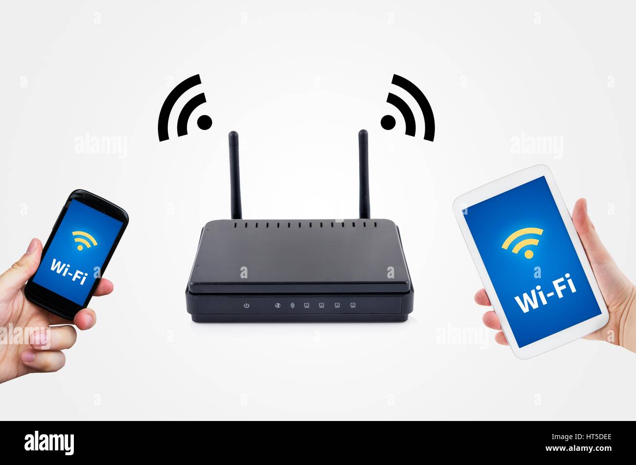 Wireless router with mobile device network concept Stock Photo - Alamy