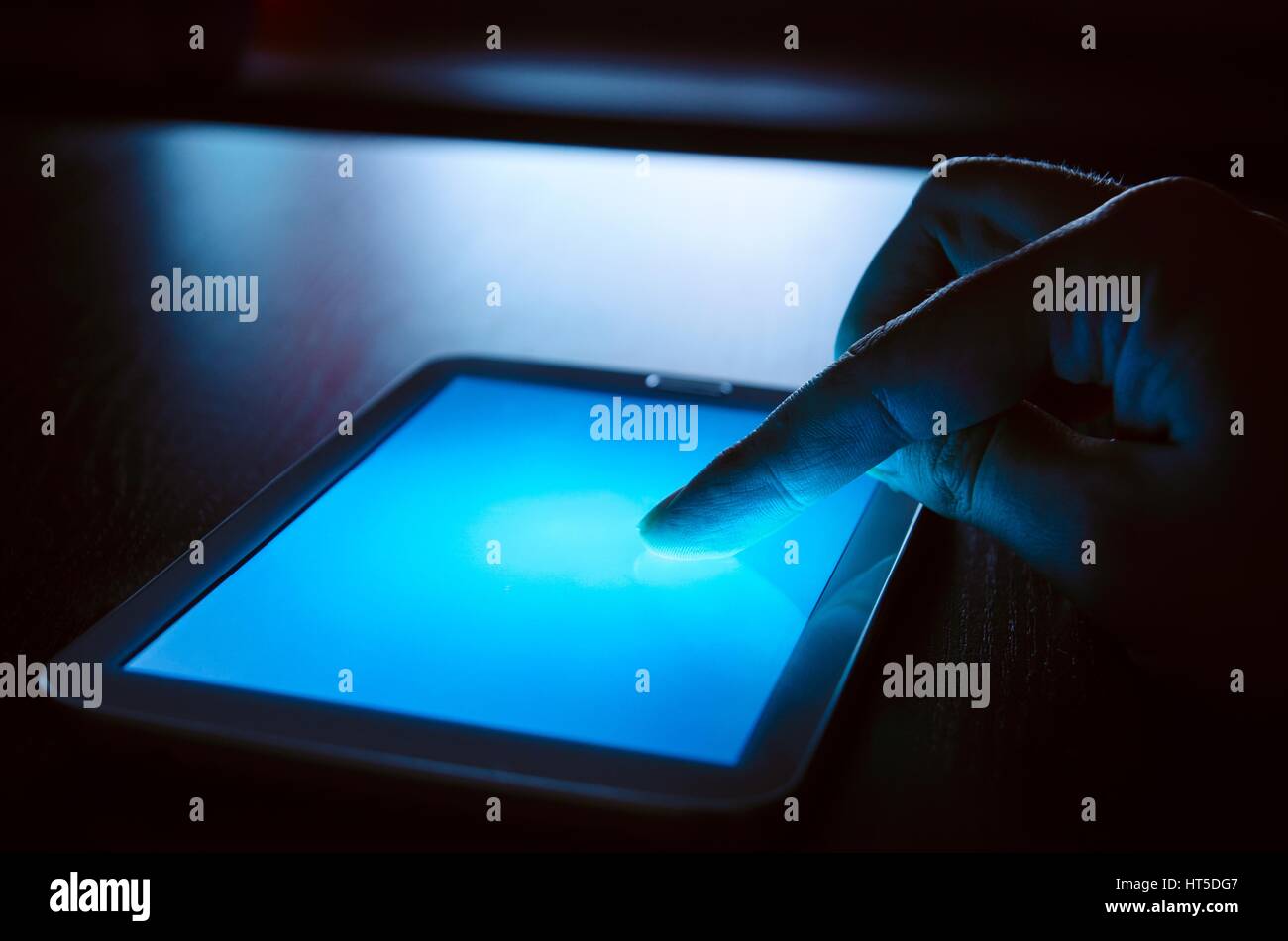 Man tablet dark hi-res stock photography and images - Alamy