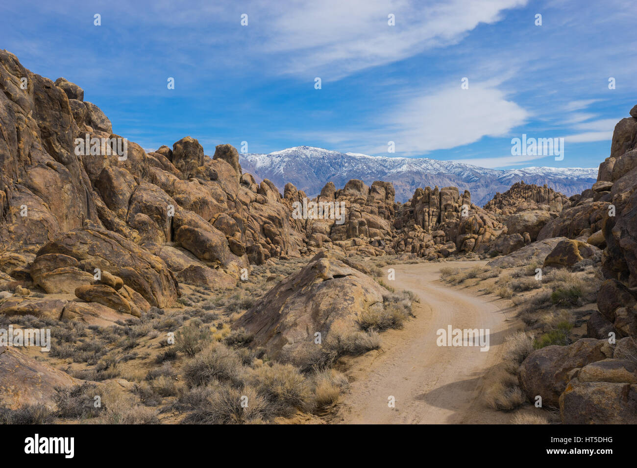 Road leading through the rock and boulders of southern California's ...