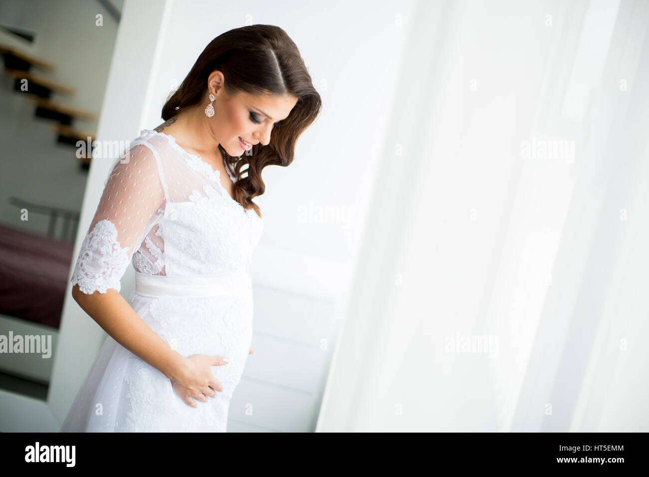 Young pregnant bride Stock Photo - Alamy