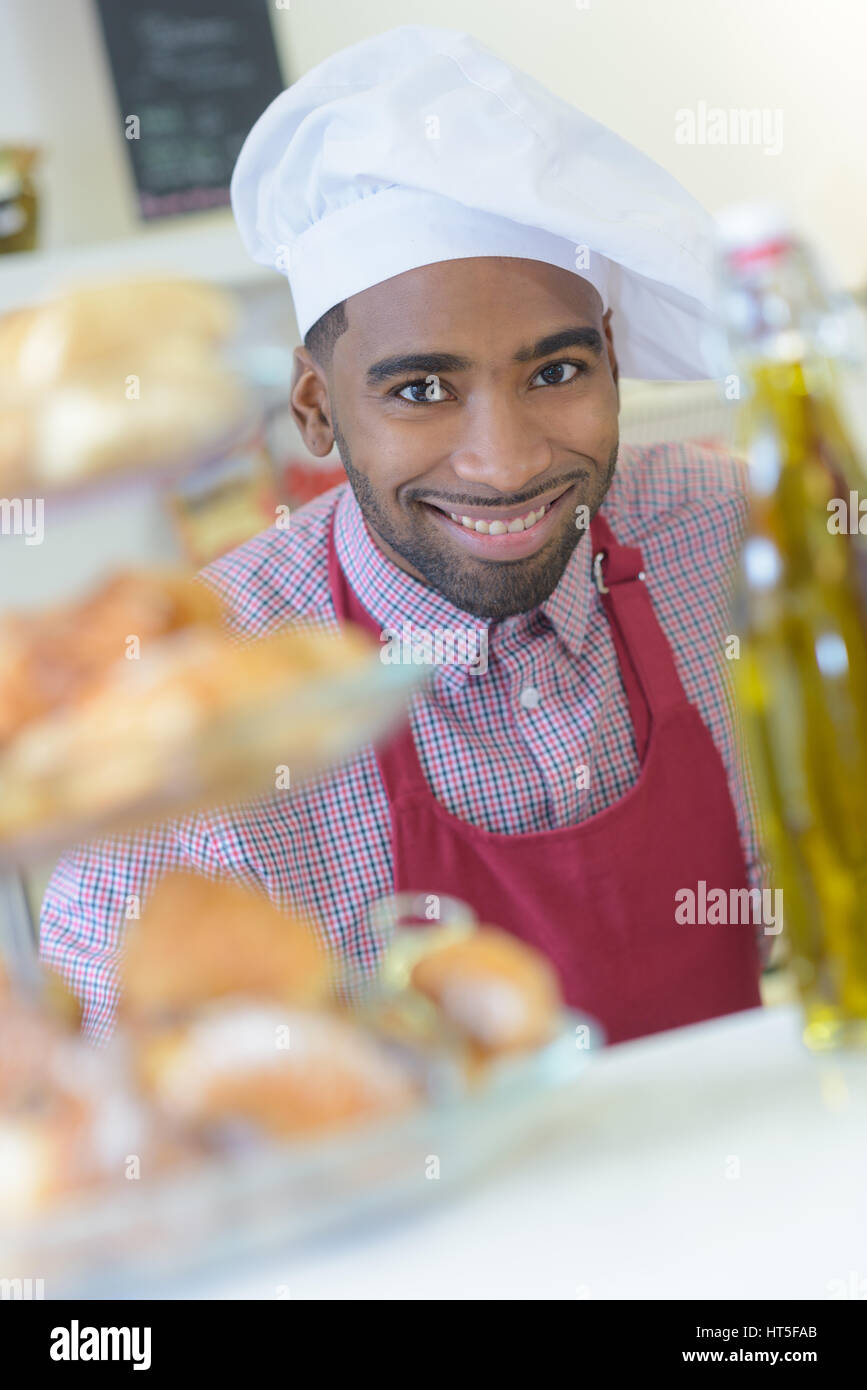 Kitchen worker serving buffet hi-res stock photography and images - Alamy