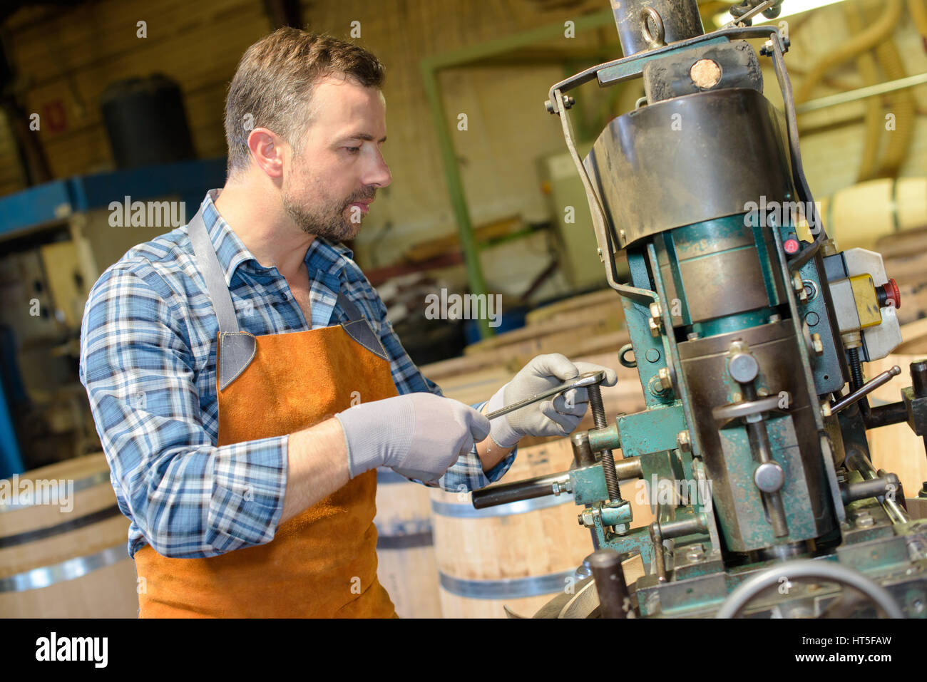 Cooper setting up machine Stock Photo - Alamy
