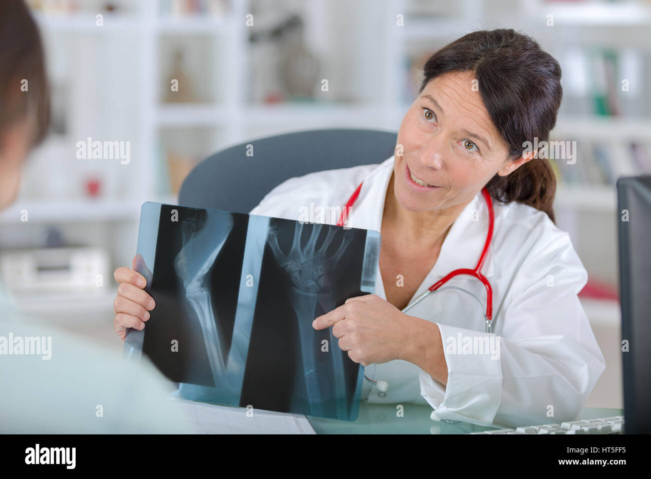 doctor shows a patient x-ray image Stock Photo - Alamy