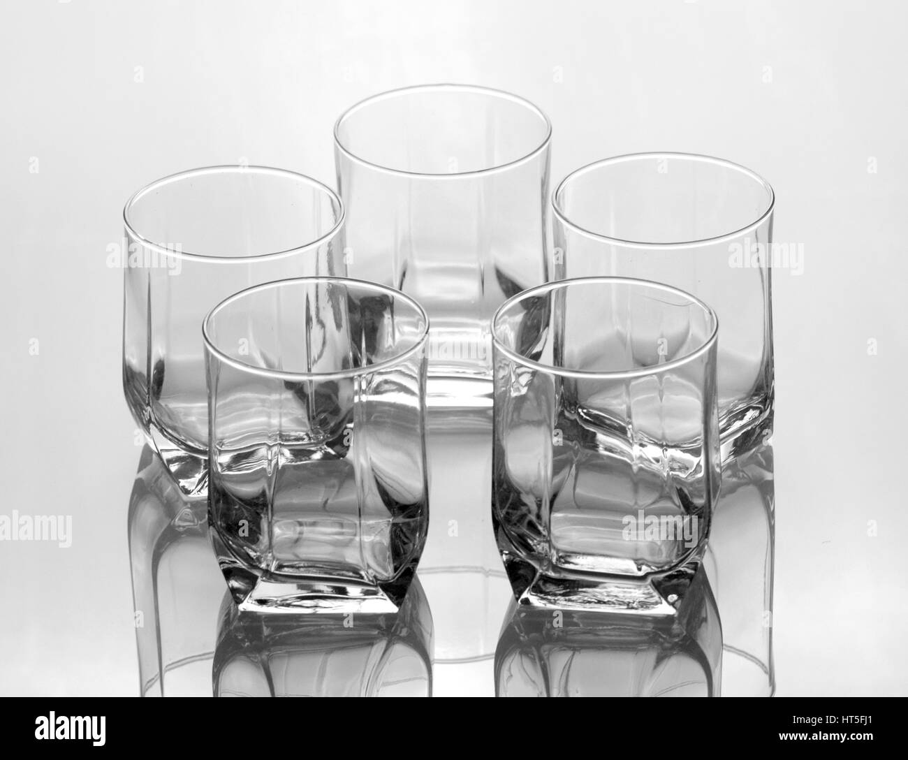 Set of five empty glasses, isolated on white background Stock Photo - Alamy