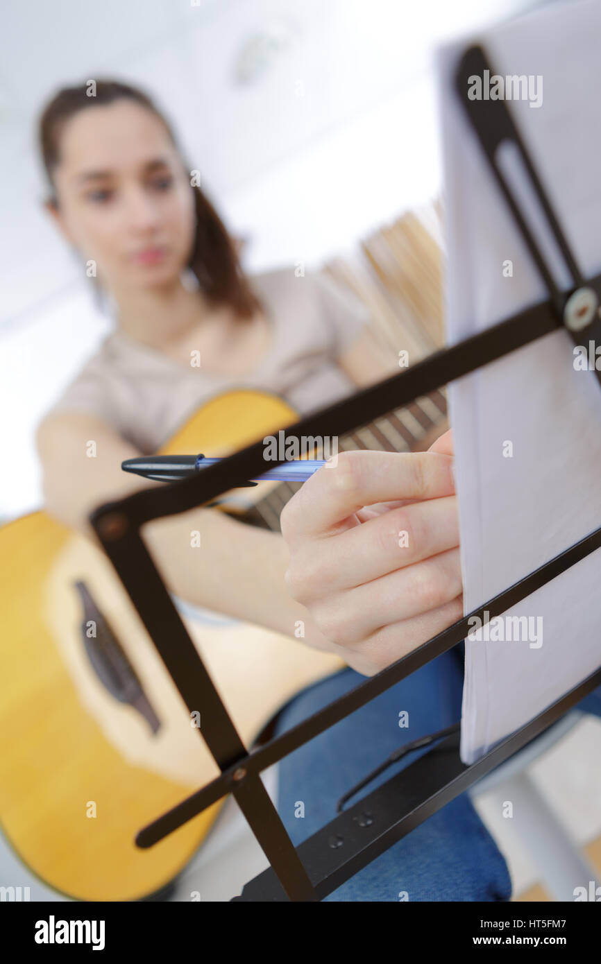 young beautiful woman writing musical score Stock Photo - Alamy
