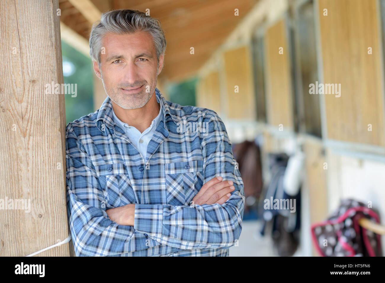 rancher at stables Stock Photo - Alamy