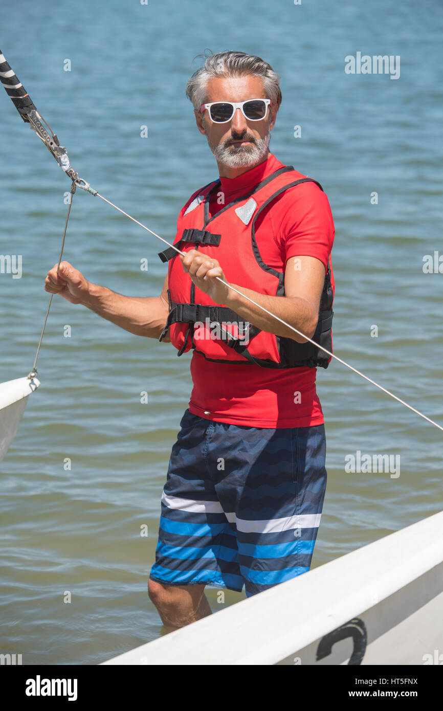 professional waterman training on lake with catamaran Stock Photo - Alamy