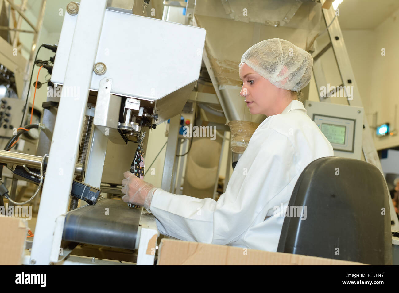 Woman on production line hi-res stock photography and images - Alamy