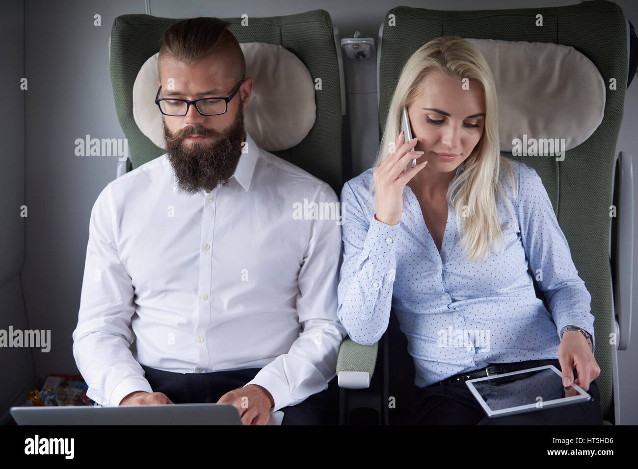 Front view of working couple Stock Photo - Alamy