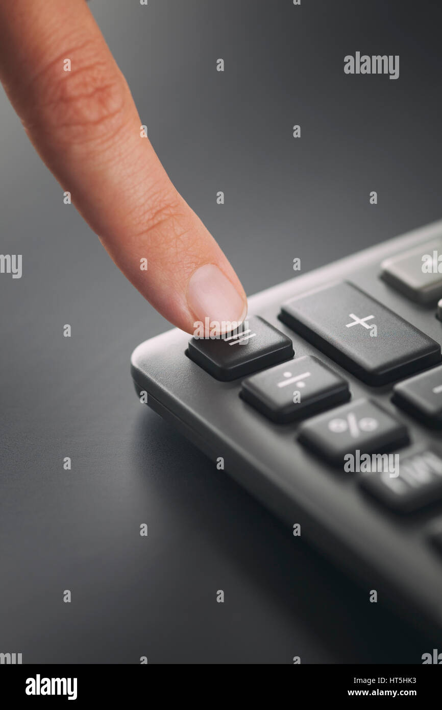 Person using calculator. Closeup Stock Photo - Alamy