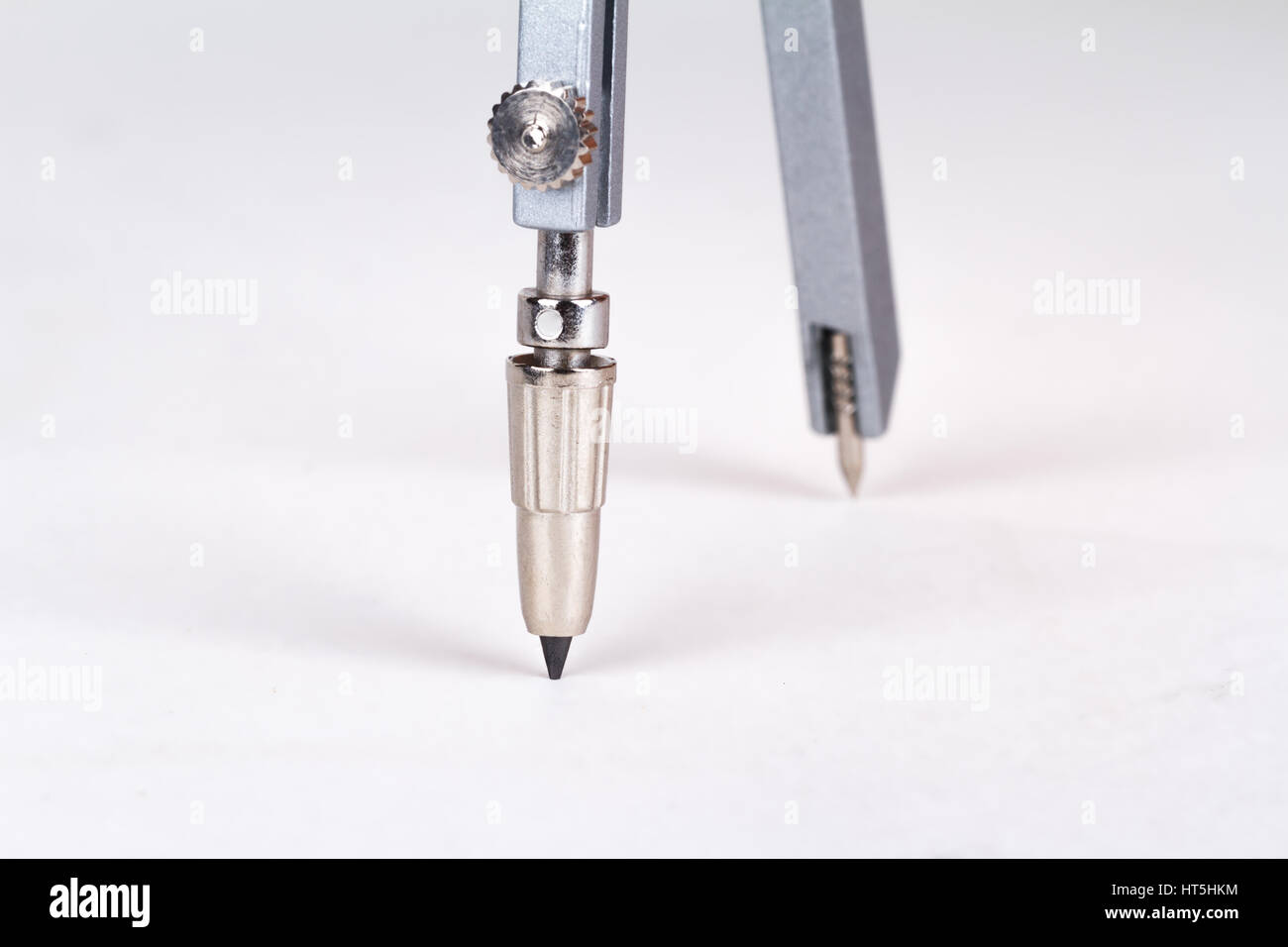 Close up detailed view of iron compasses, isolated on white background ...