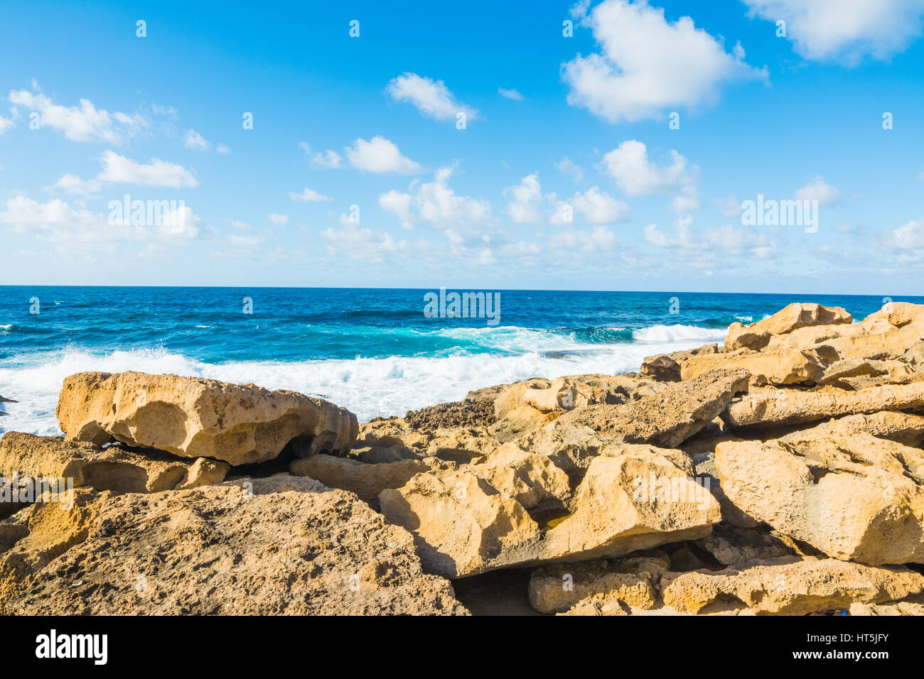 Yellow rocks by the shore in Sardinia, Italy Stock Photo - Alamy