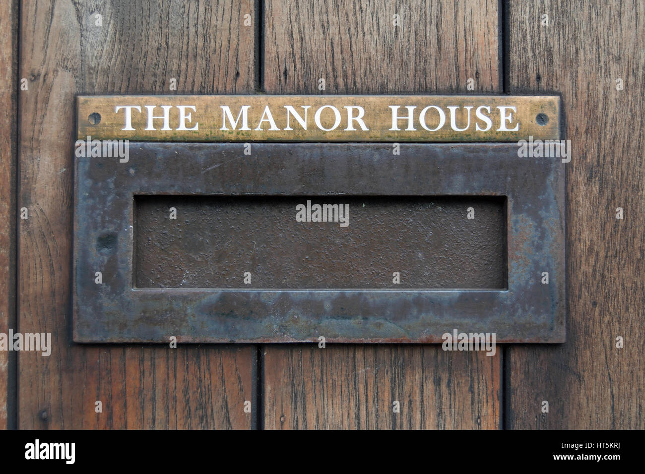 letter box in wooden gate labelled the manor house, in ham, surrey ...