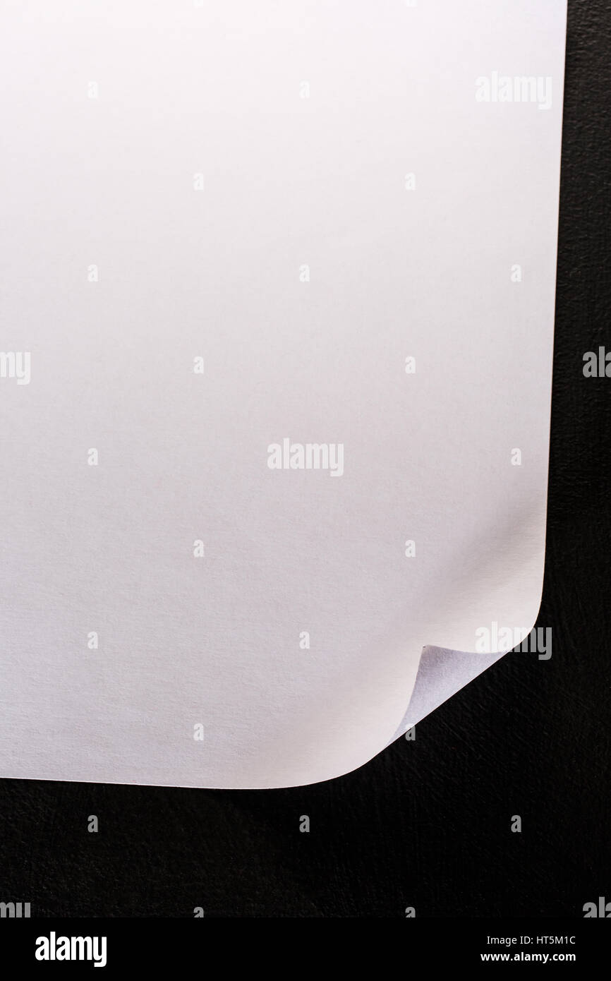 Blank sheet of paper on black background Stock Photo - Alamy