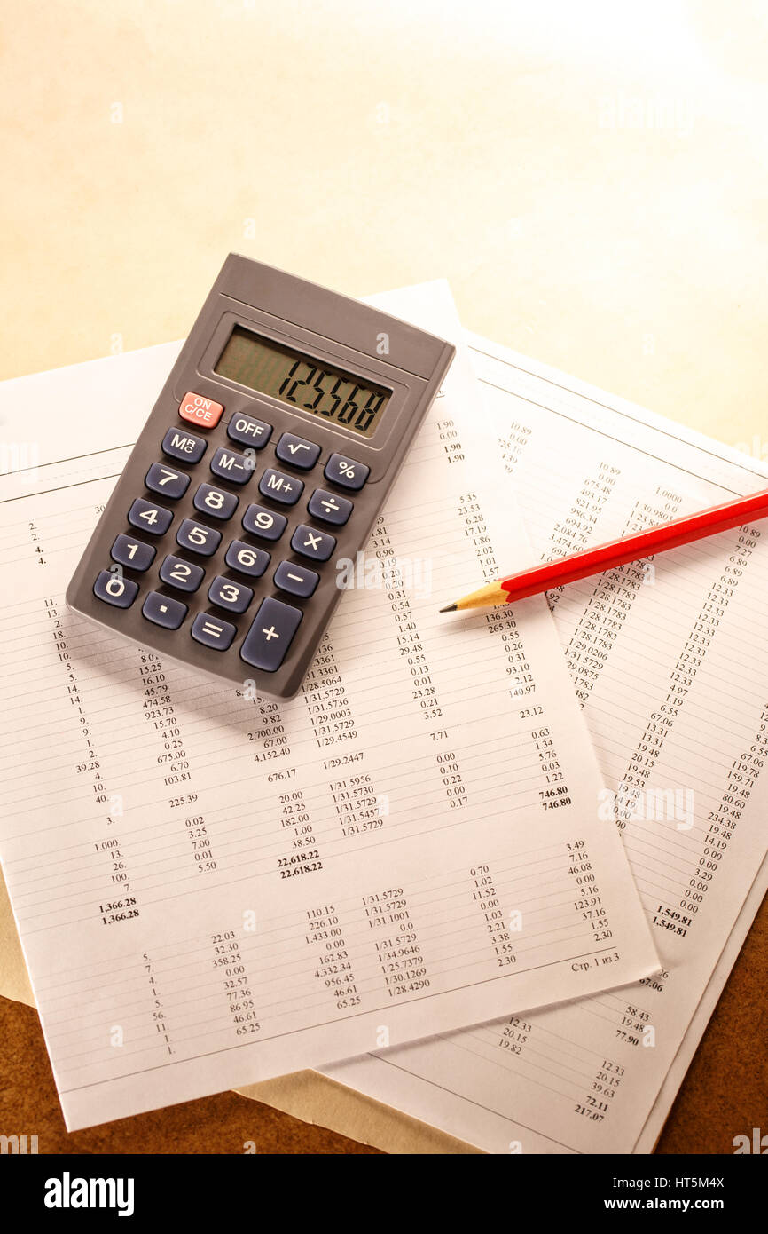 Operating budget, calculator and pencil in closeup Stock Photo - Alamy
