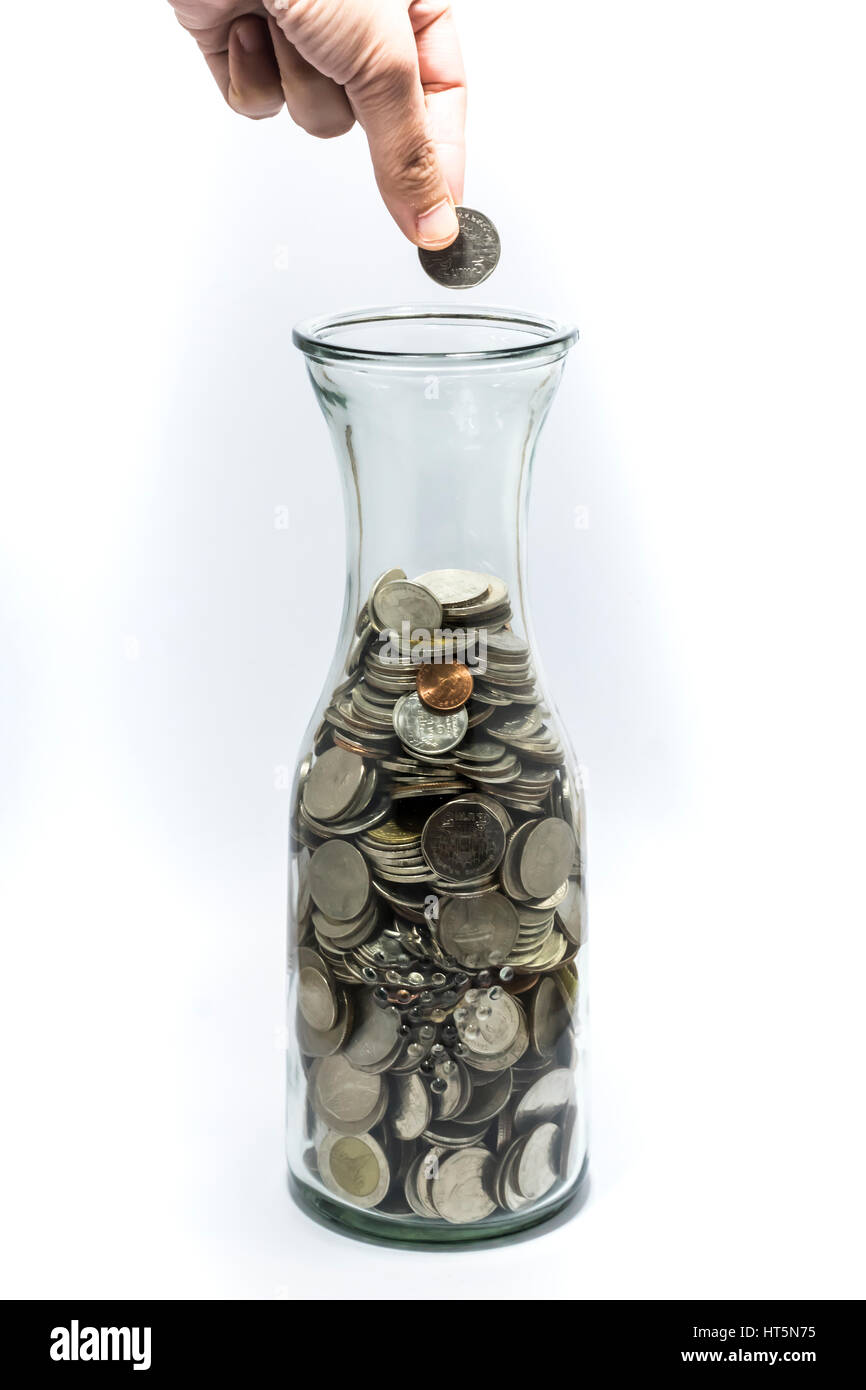 Many bath coin in the bottle on white background Stock Photo - Alamy