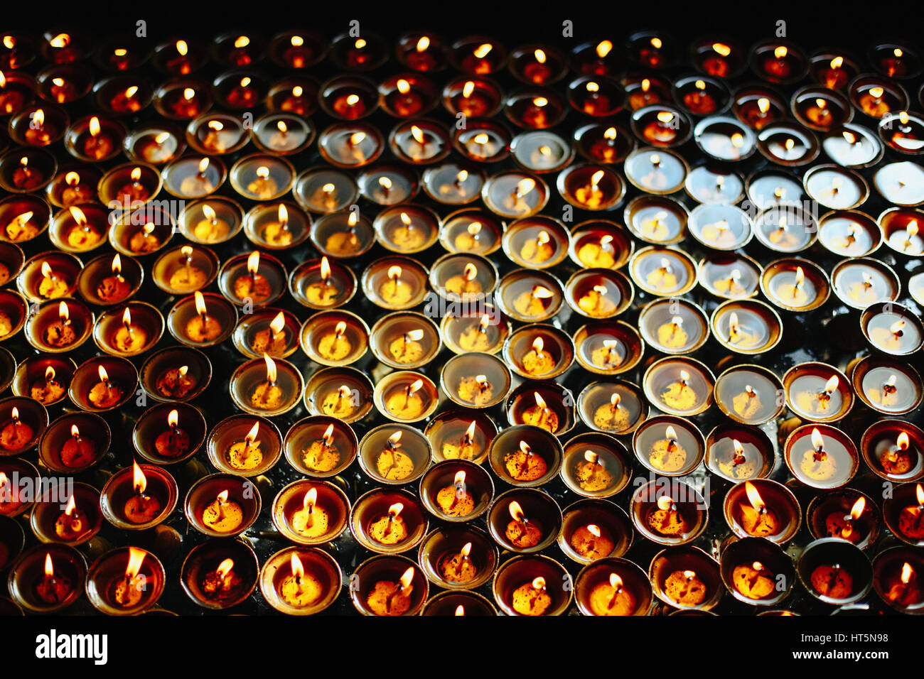 Oil lamps burning in the temple Stock Photo - Alamy