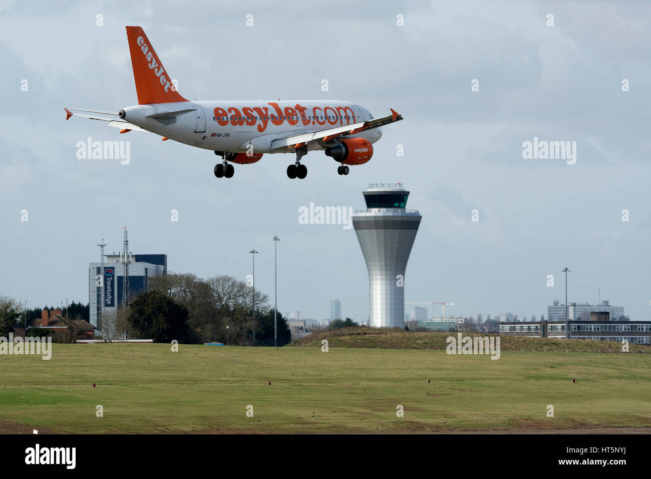 Easyjet Airbus A319 landing at Birmingham Airport, UK (HB-JYH Stock ...