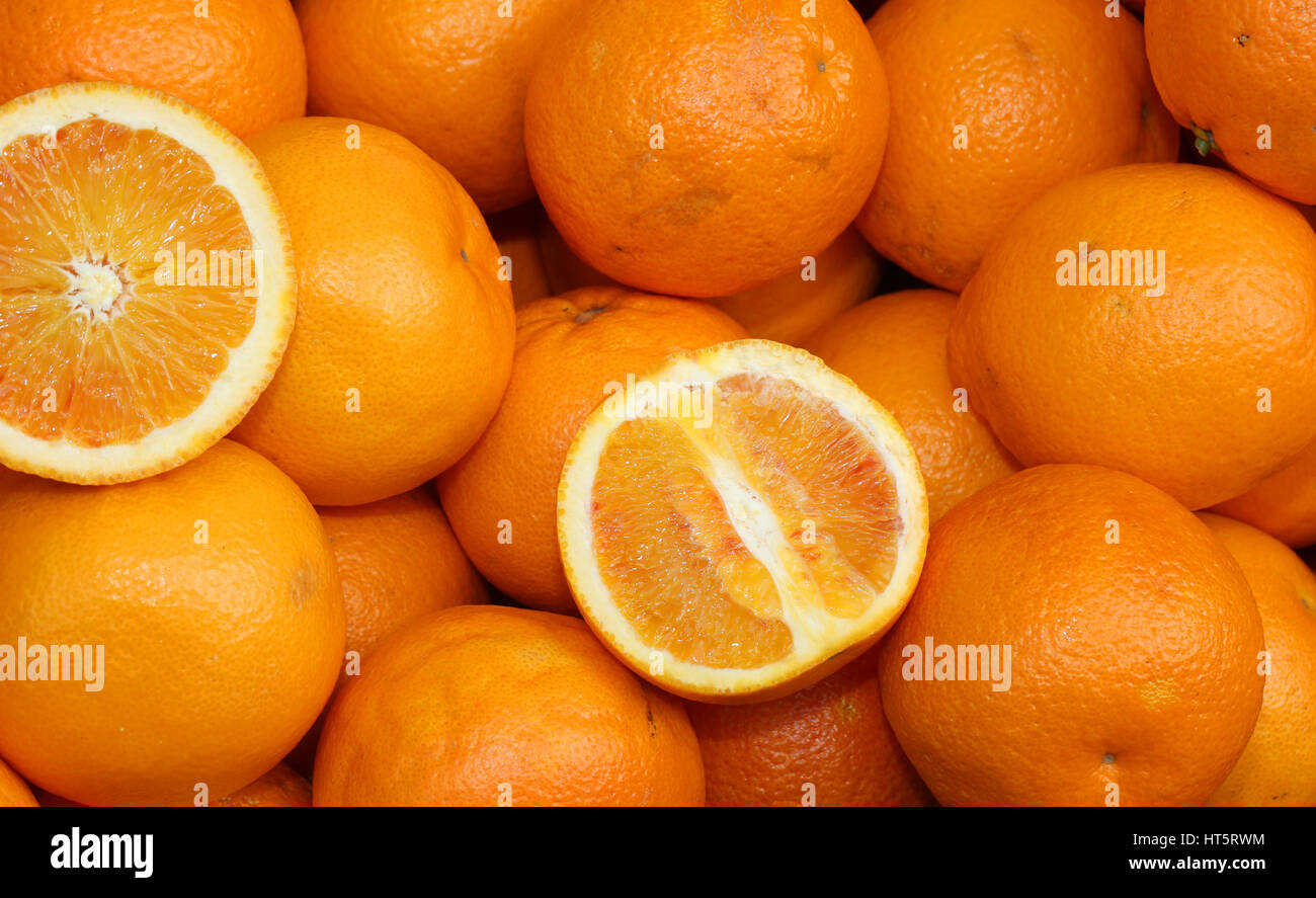 Oranges and slices of an orange cut in the greengrocer's stall Stock ...