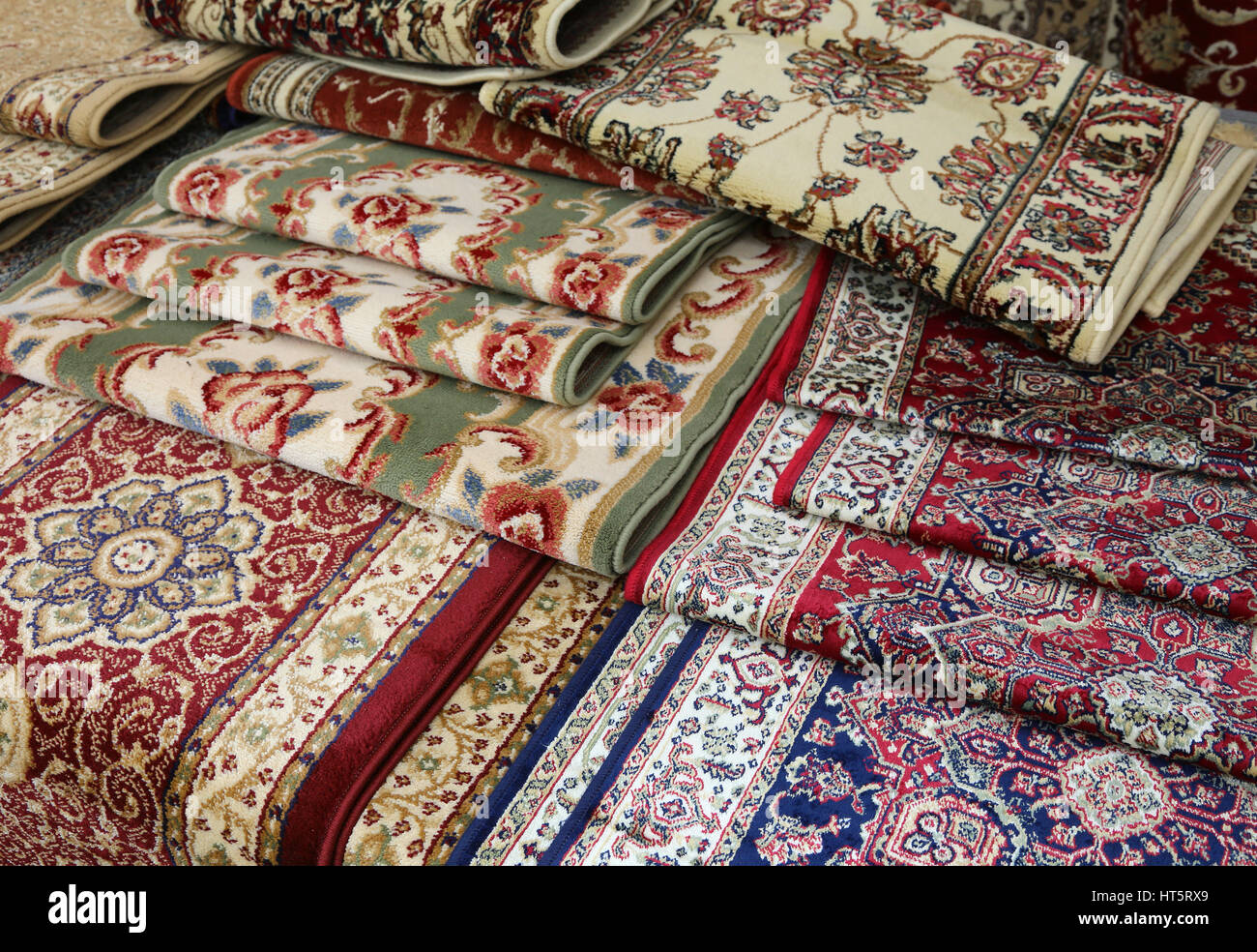 heap of many of various origin and quality carpets Stock Photo - Alamy