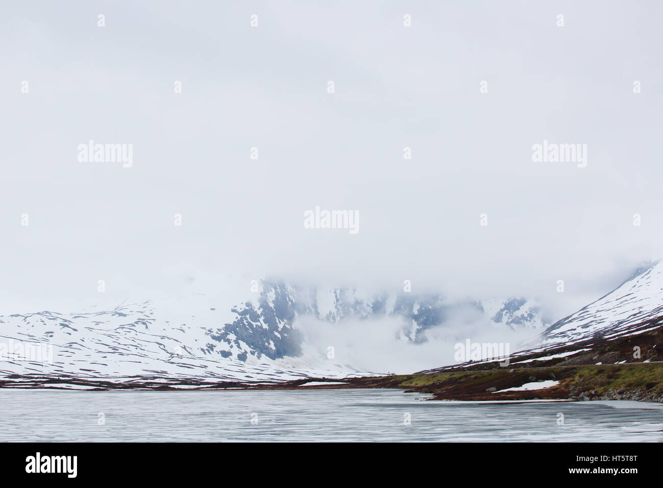 View of beautiful spring Norway landscape with mountains and melting ...