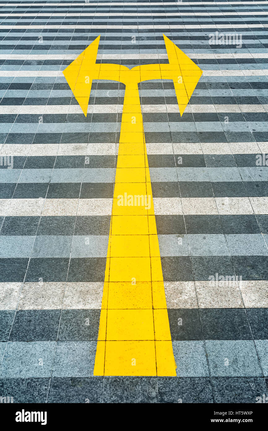 Varicolored pave with the yellow road marking. It is a line with a two ...