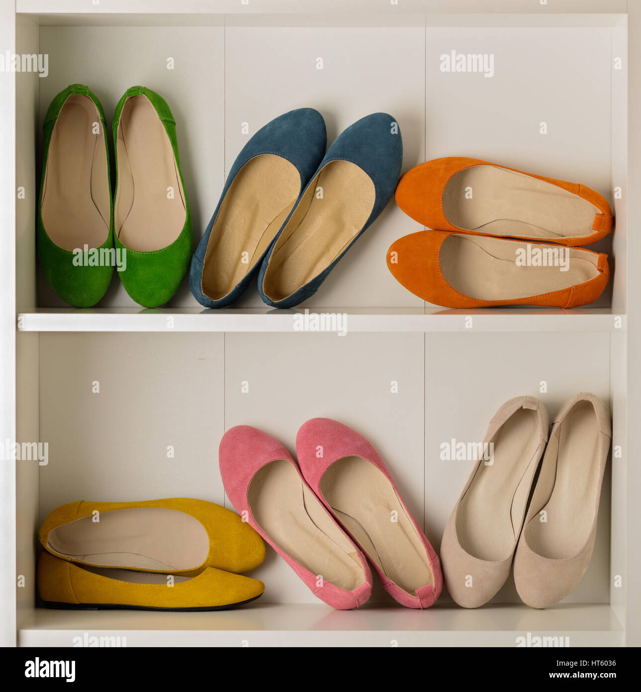 Rows of colorful women's shoes (ballet shoes) in the wardrobe ...