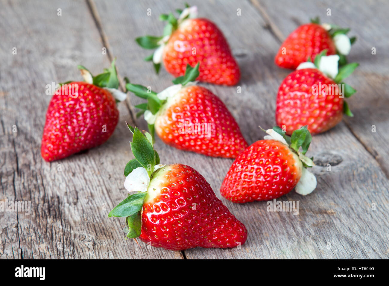 Close up of Fresh strawberries on wood table background Stock Photo - Alamy