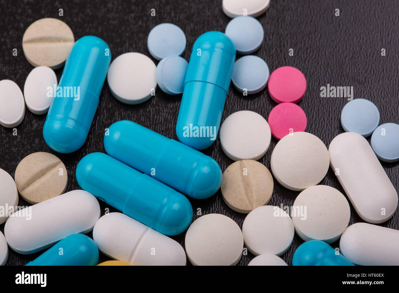 different tablets pills capsule heap mix therapy drugs Stock Photo - Alamy