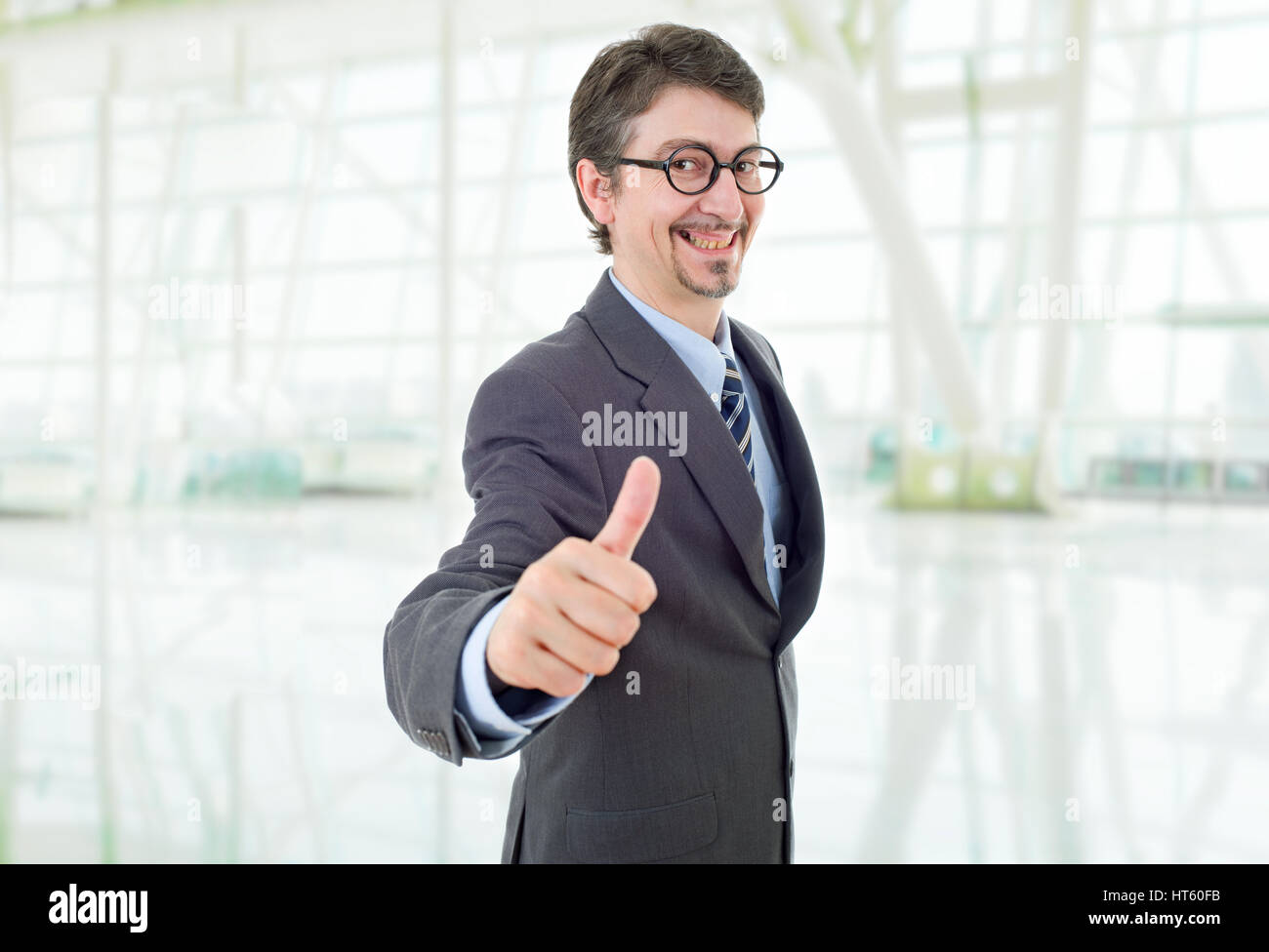 young business man going thumb up, at the office Stock Photo - Alamy