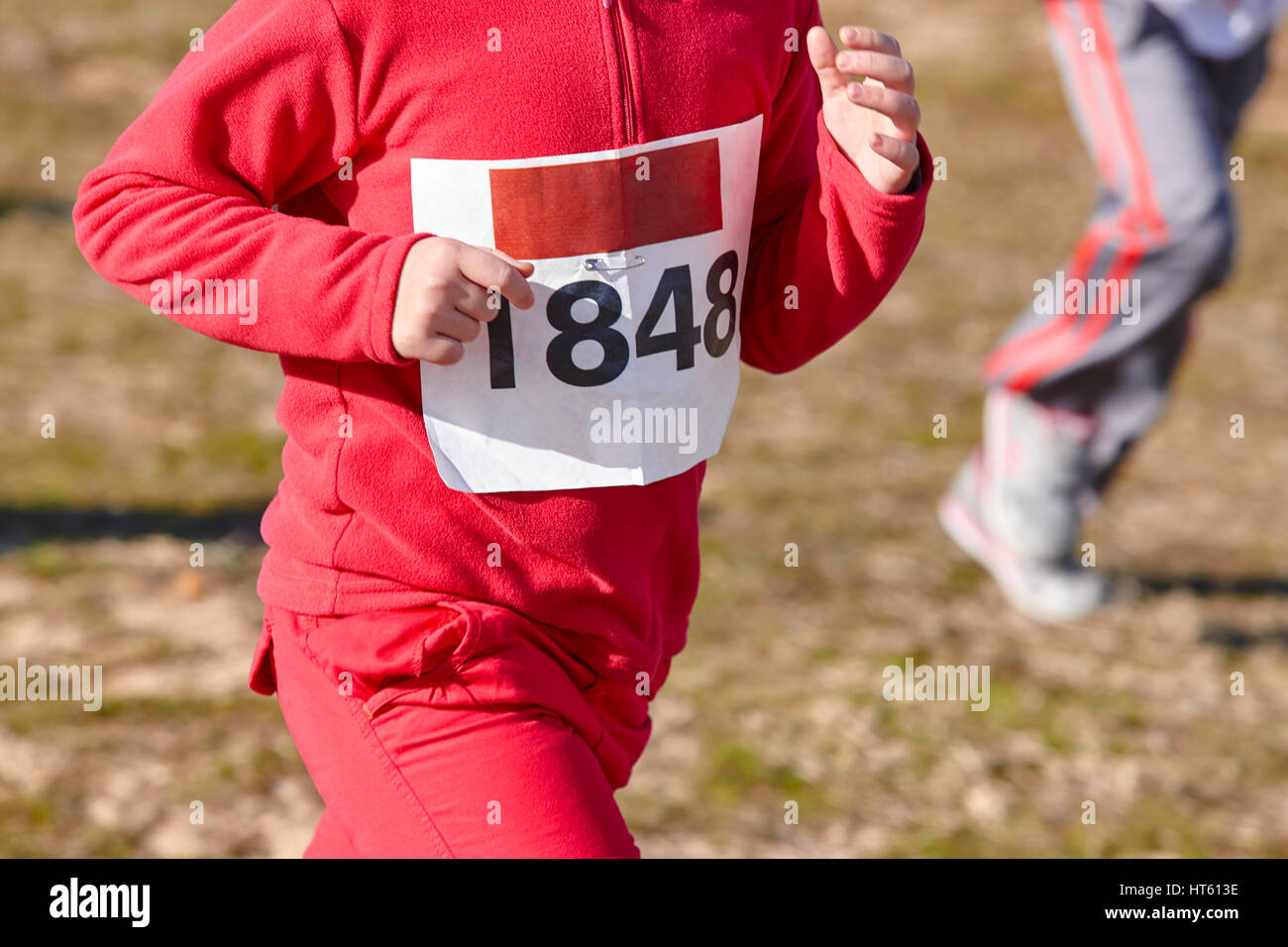 Young athletics runner on a race. Outdoor circuit. Horizontal Stock ...