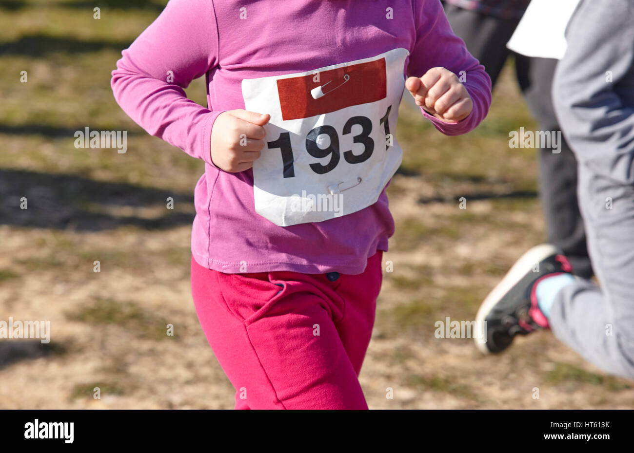 Young athletics runners on a country race. Outdoor circuit. Horizontal ...