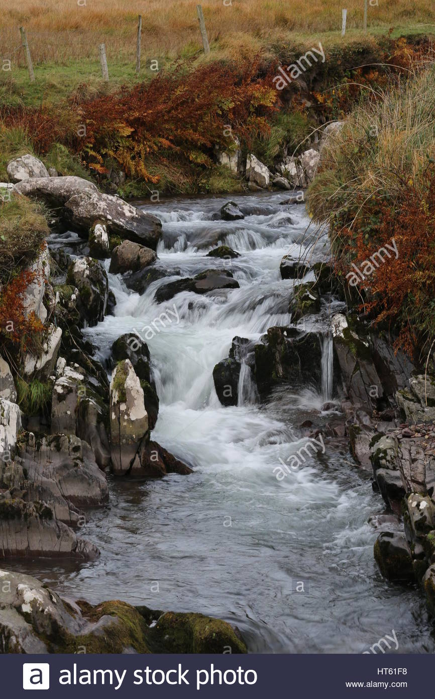 A stream rushing to the Atlantic Ocean at Brandon Creek,County Kerry ...