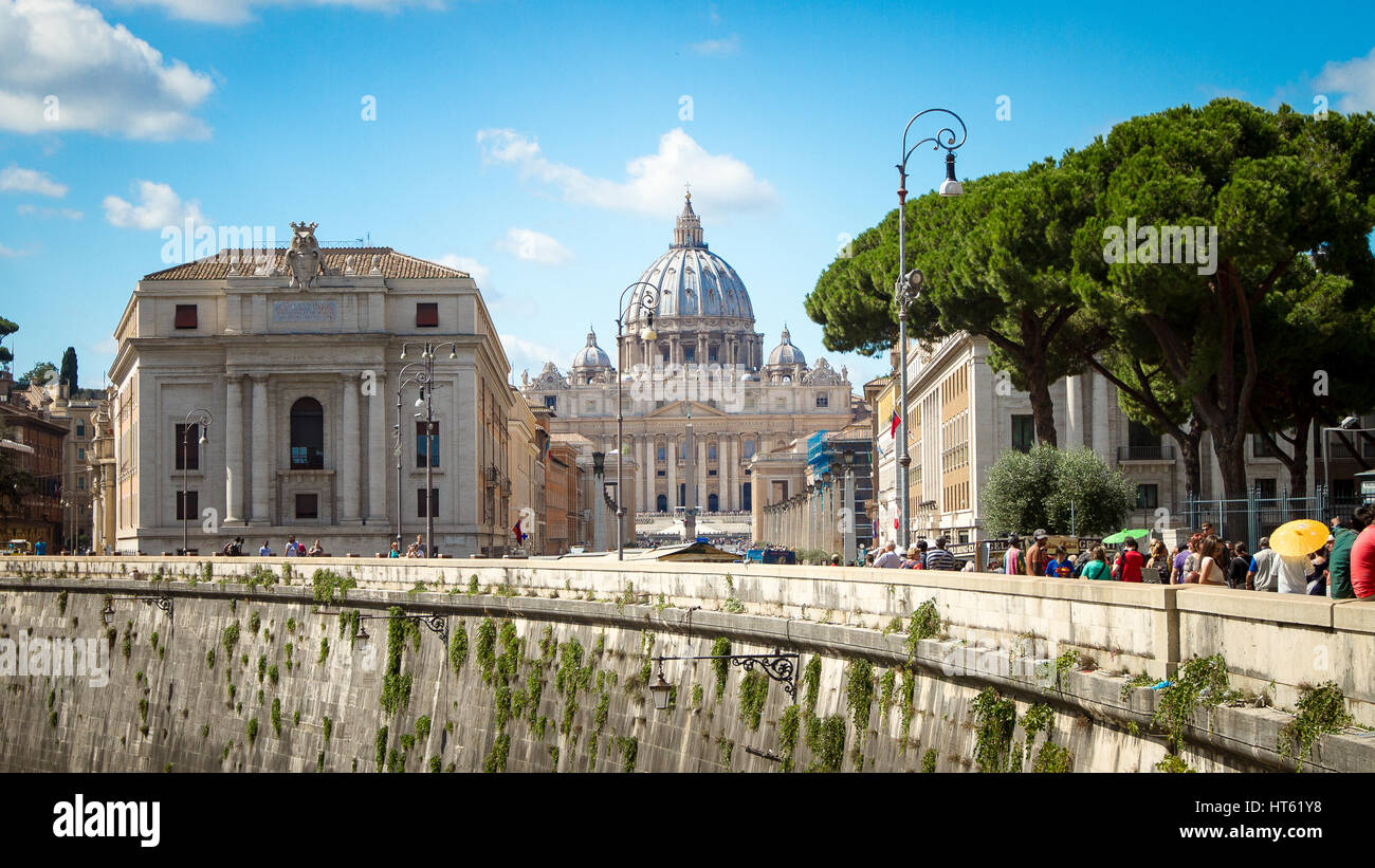 View of St Peters Basilica and the Vatican, Rome with tourists walking ...