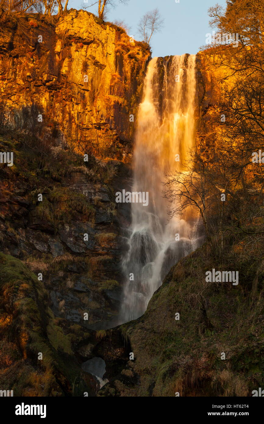 Pistyll Rhaeadr waterfall is bathed in early morning golden light Stock ...